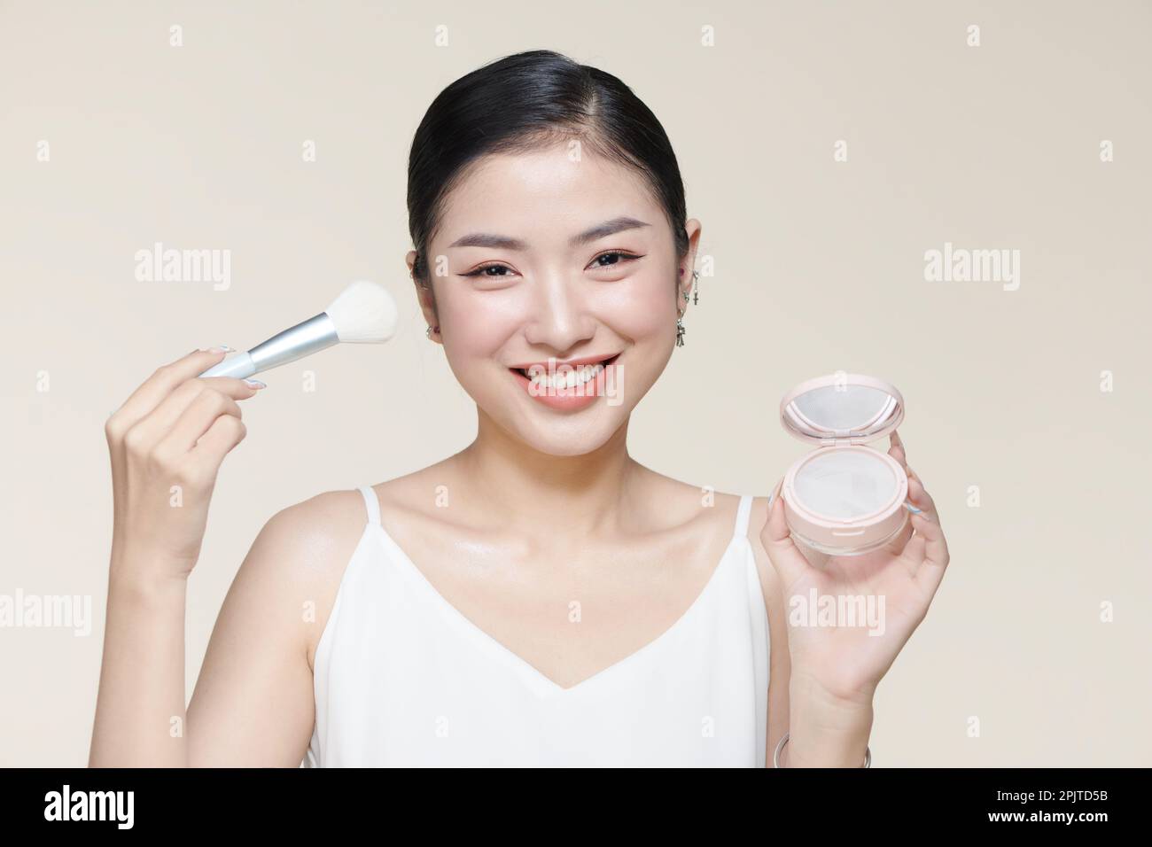 Powder blush woman Asian appearance smile and makeup brush Stock Photo ...