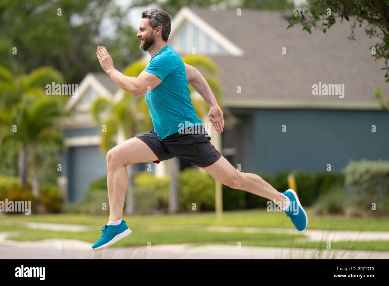 Running man sprinting workout outdoor. Fit athlete man running on ...