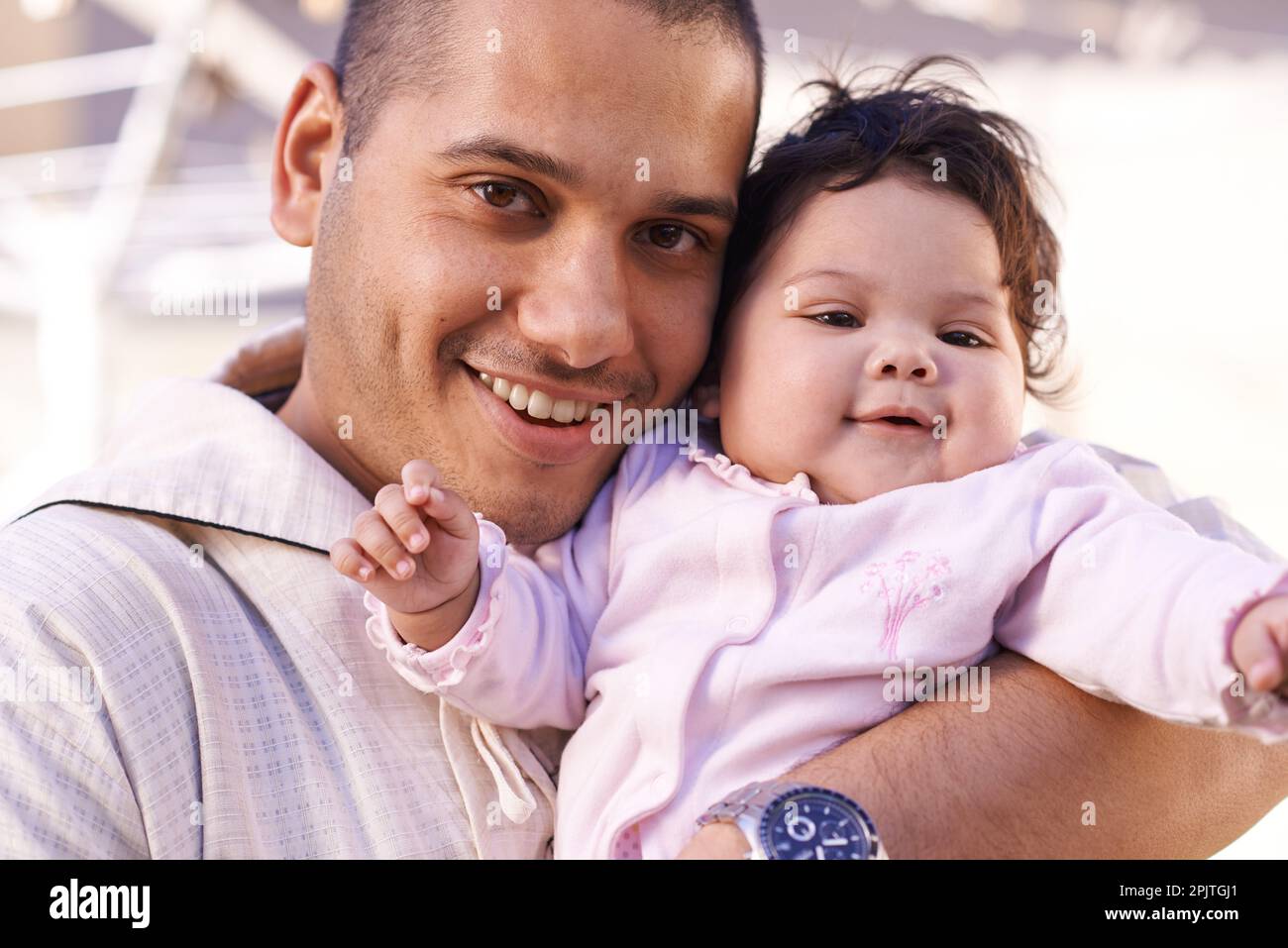 Say cheese for daddy. a father cradling his little baby girl Stock ...