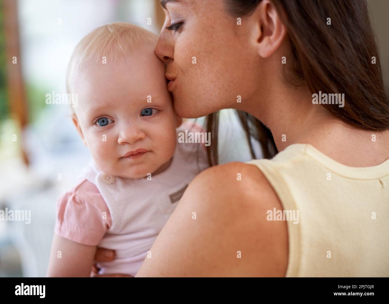 Youre my sweet little bundle of joy. a mother holding her baby girl at home Stock Photo - Alamy