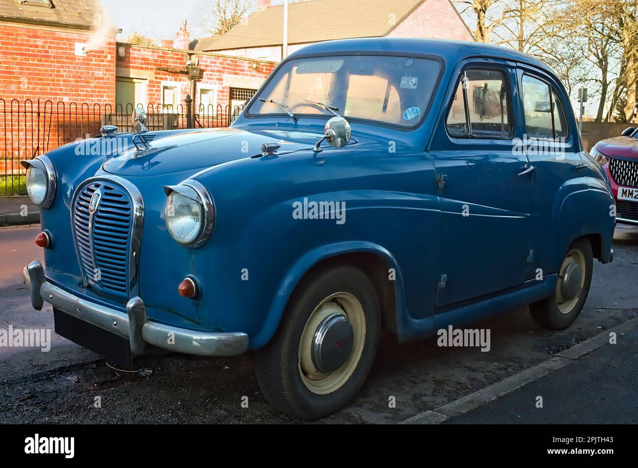 Blue Austin A30 / A 35 four-door saloon car parked on the street Stock ...
