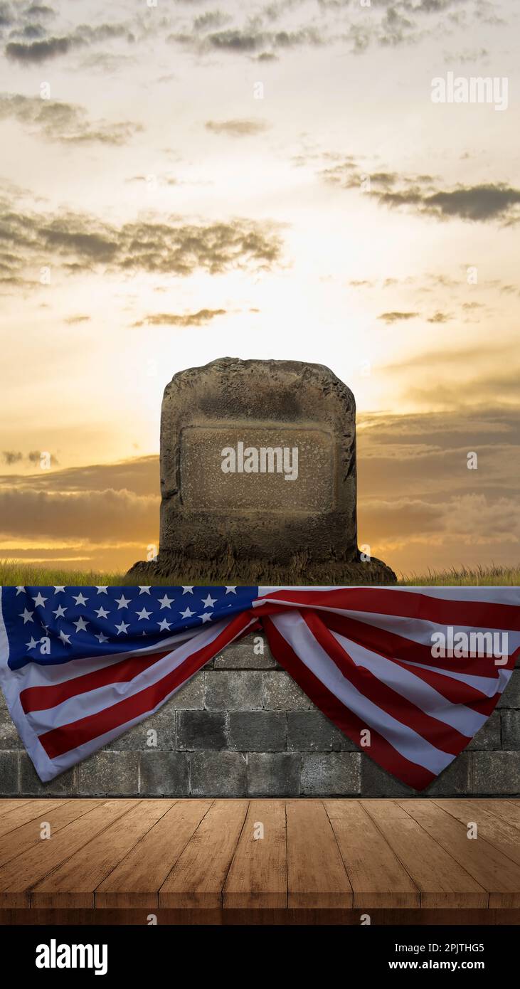 Tombstone with an American flag on the cemetery. Memorial day concept ...
