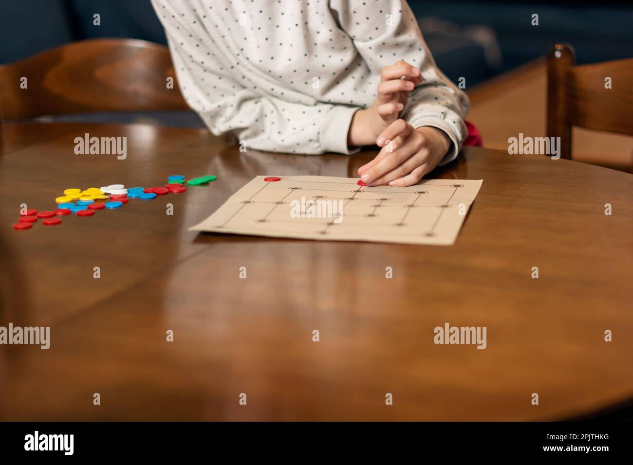 Girl playing board game hi-res stock photography and images - Alamy