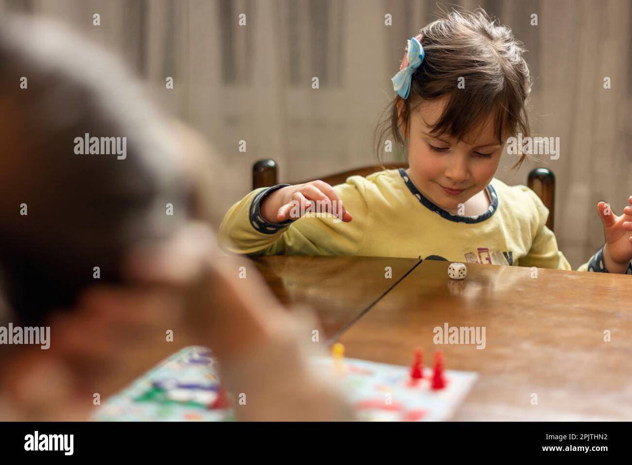 Two girls playing board game hi-res stock photography and images - Alamy