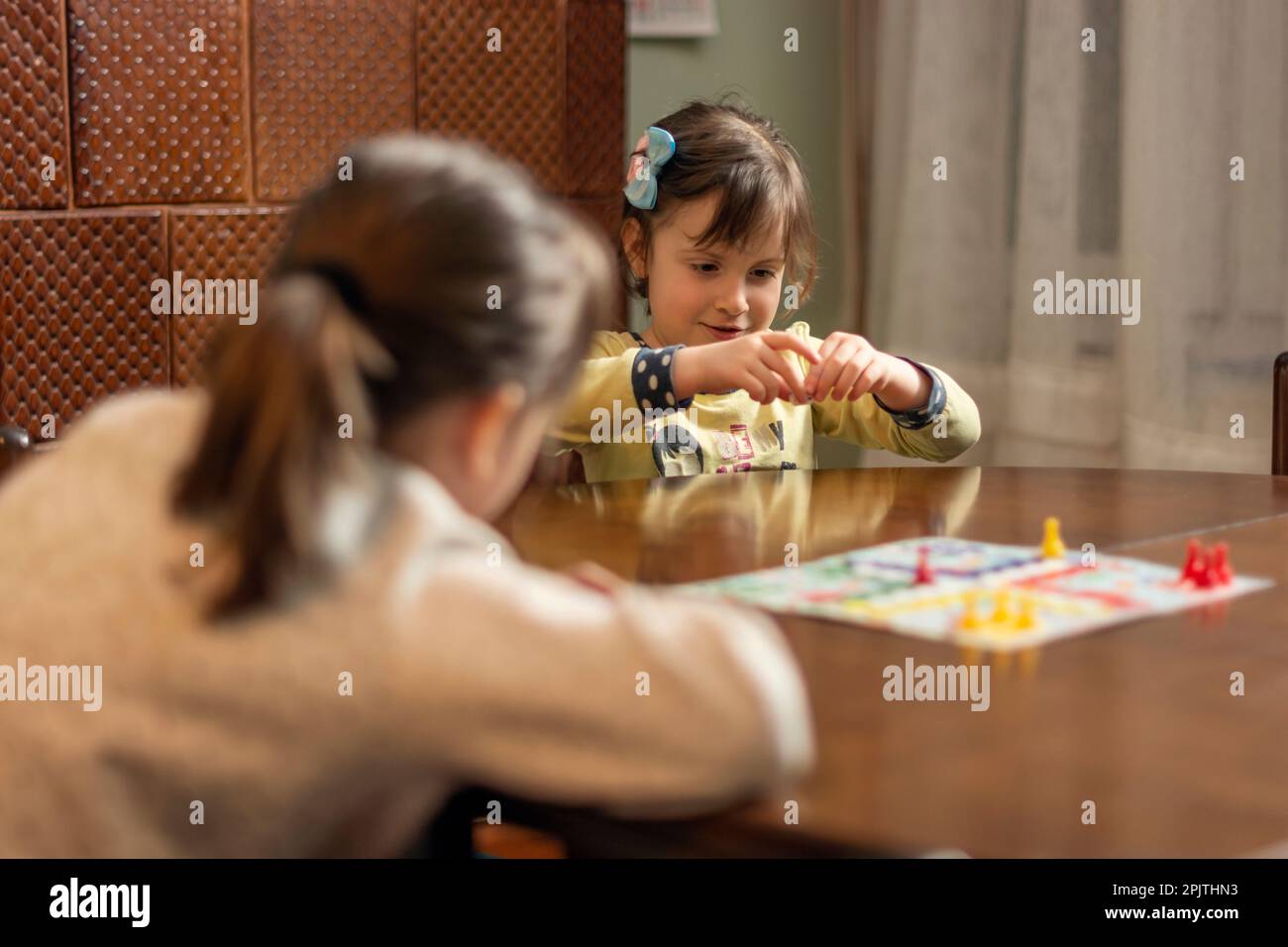 Two girls playing board game hi-res stock photography and images - Alamy