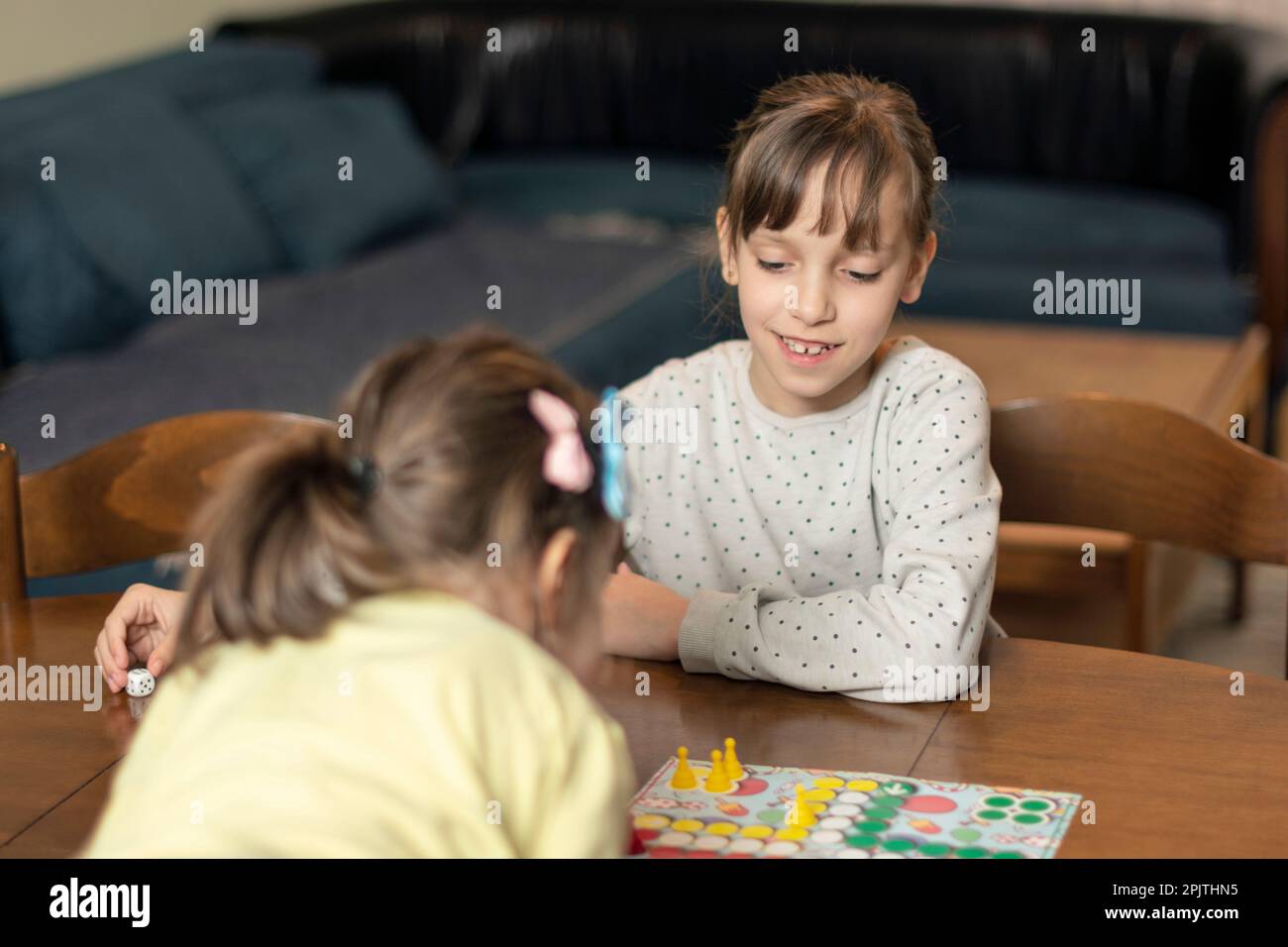 Two girls playing board game hi-res stock photography and images - Alamy