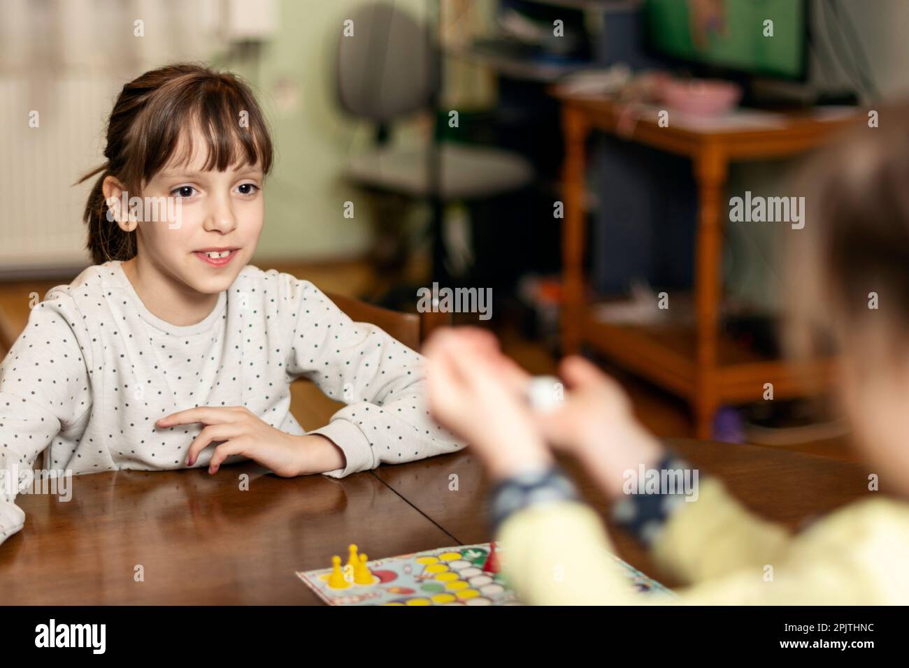 Two girls playing board game hi-res stock photography and images - Alamy