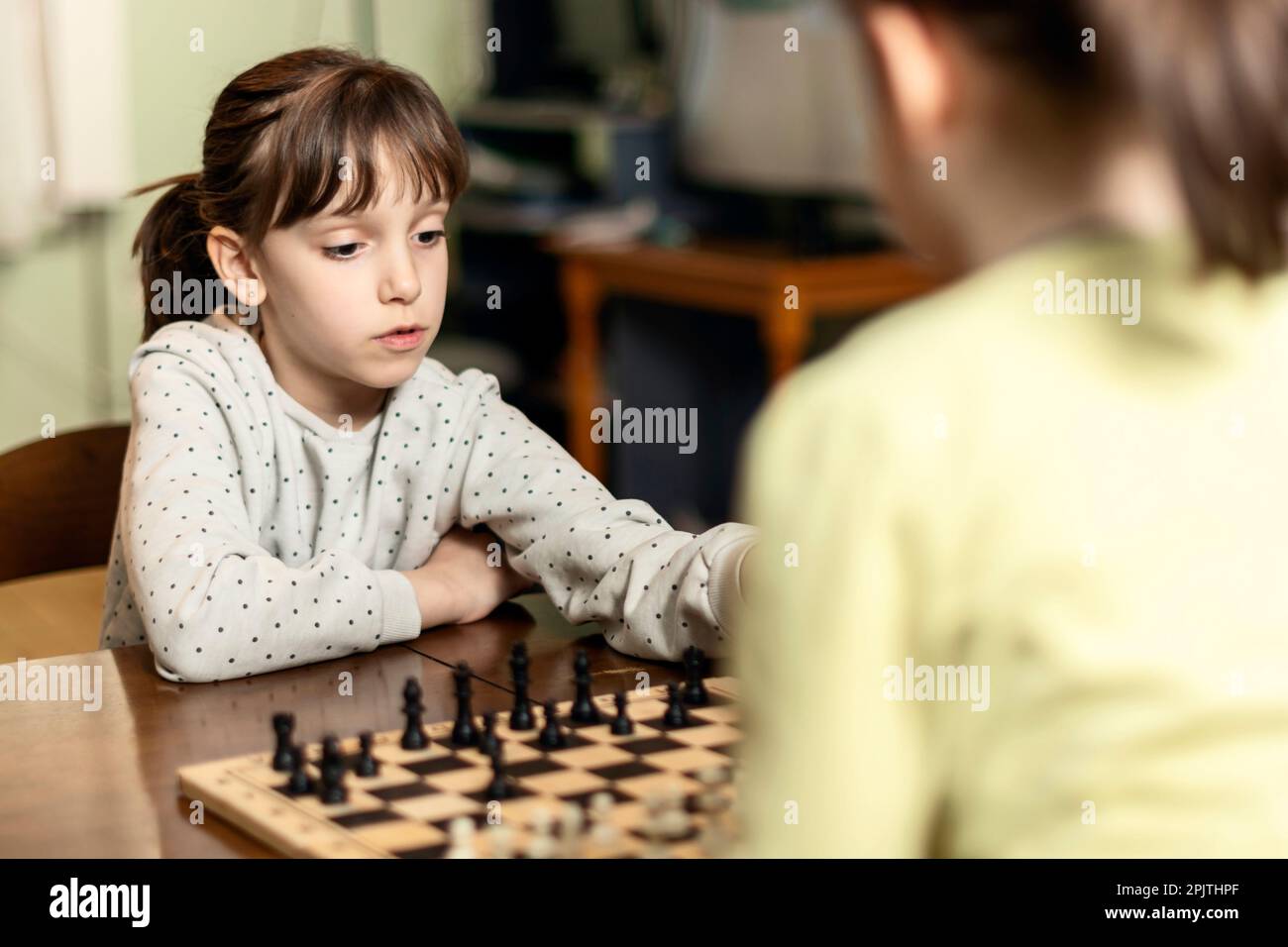 Two children playing chess hi-res stock photography and images - Alamy
