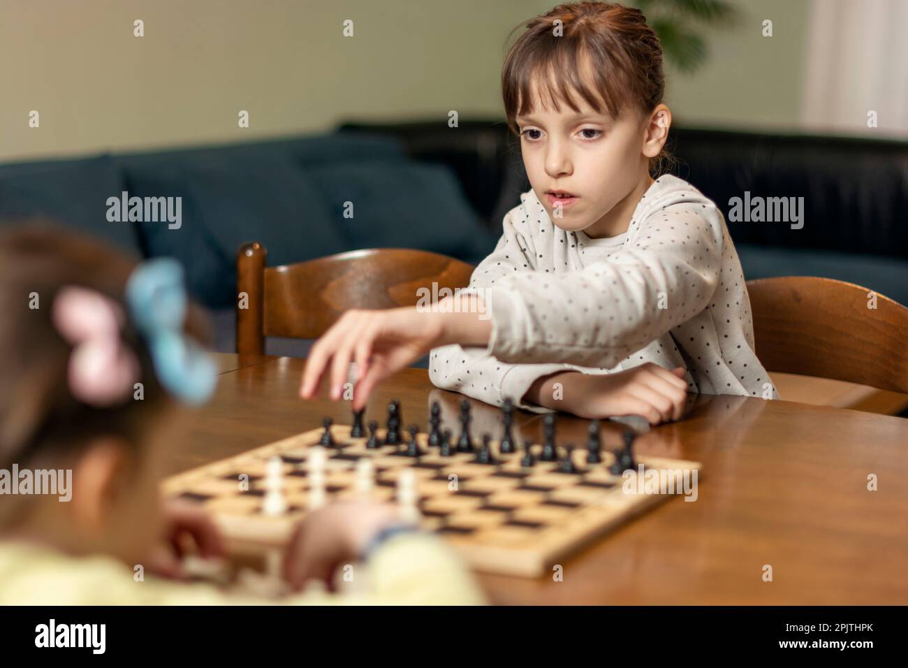 Two children playing chess hi-res stock photography and images - Alamy