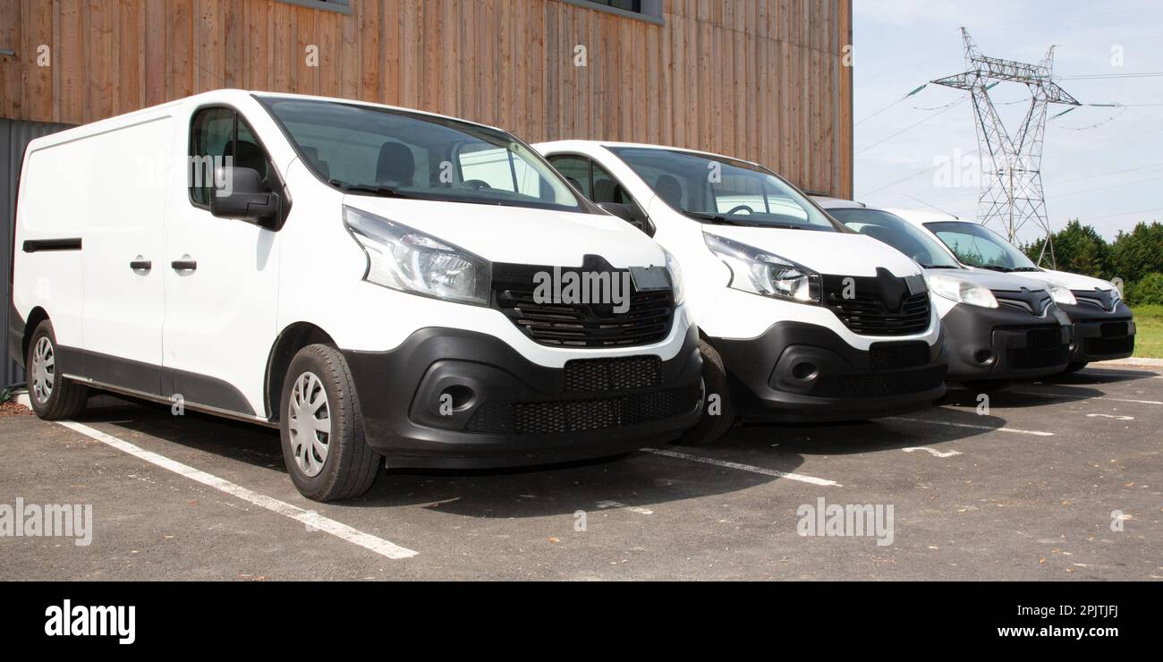 delivery van small trucks line up park outside Stock Photo - Alamy