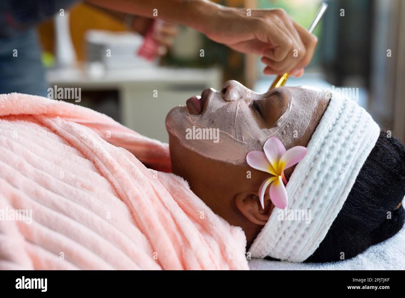Relaxed plus size african american woman having beauty face mask ... Relaxed plus size african american woman having beauty face mask ...