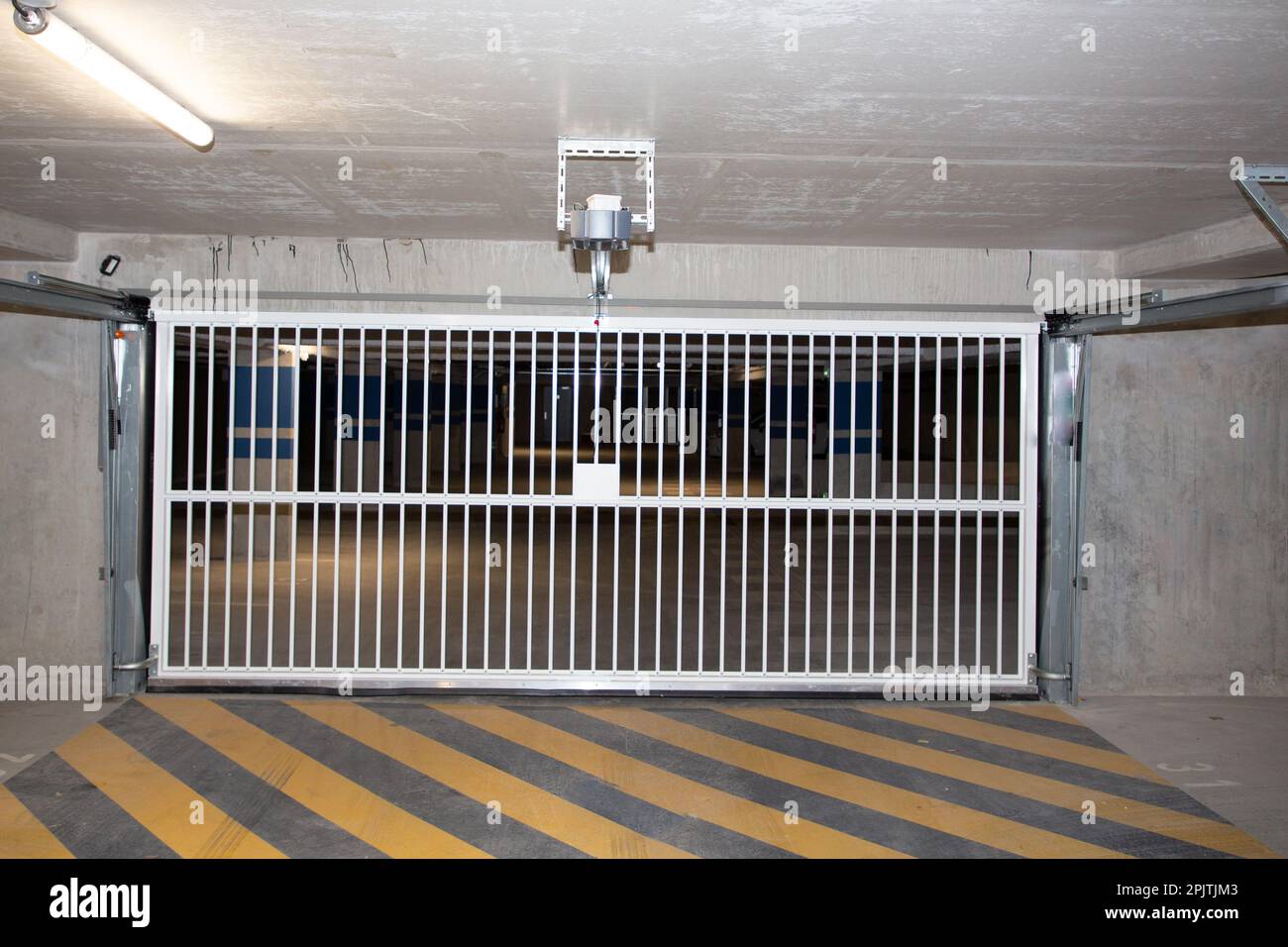 underground car park garage parking entry door gate Stock Photo - Alamy