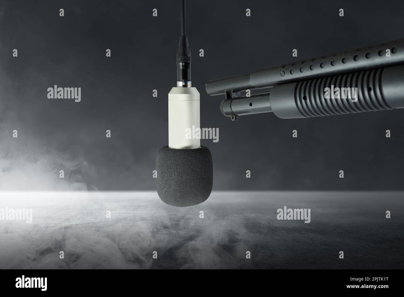 Gun aiming at the microphone. World press freedom day concept Stock ...