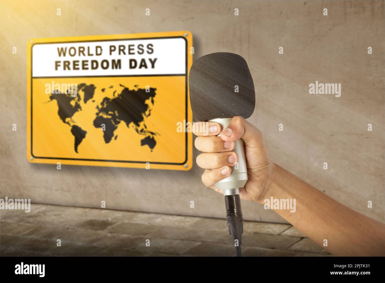 Human hand holding a microphone. World press freedom day concept Stock Photo - Alamy