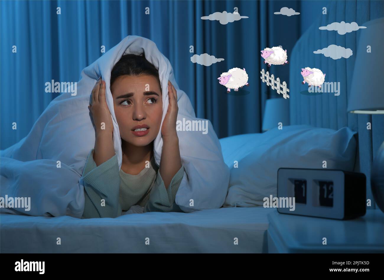 Young woman trying to fall asleep counting sheep in bed at night Stock ...