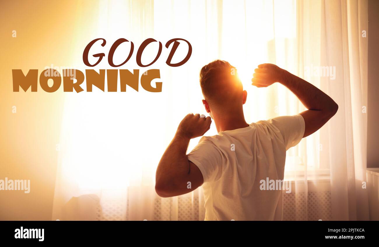 Good Morning! Man stretching near window at home, back view Stock Photo ...