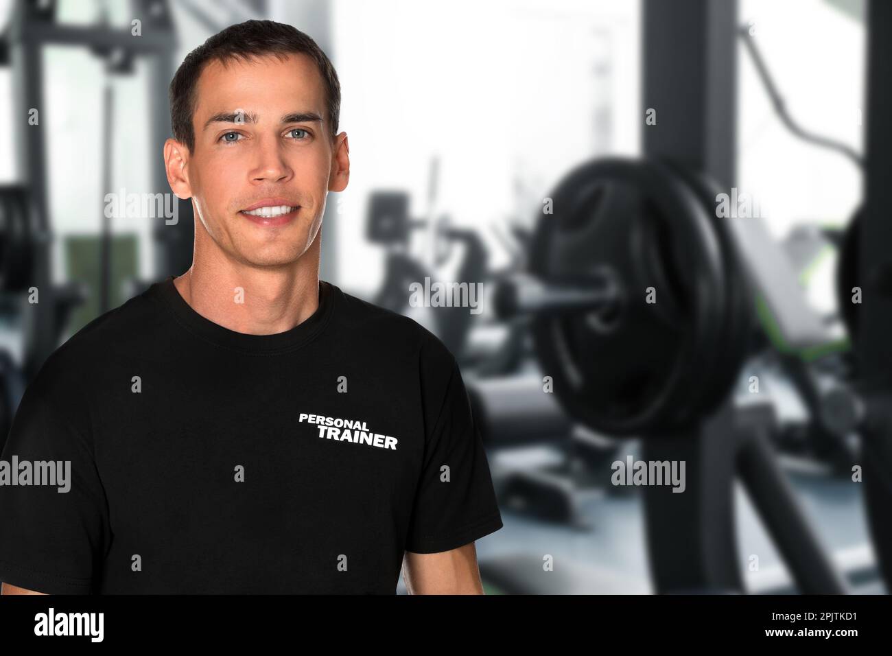 Portrait of professional personal trainer in gym. Space for text Stock ...