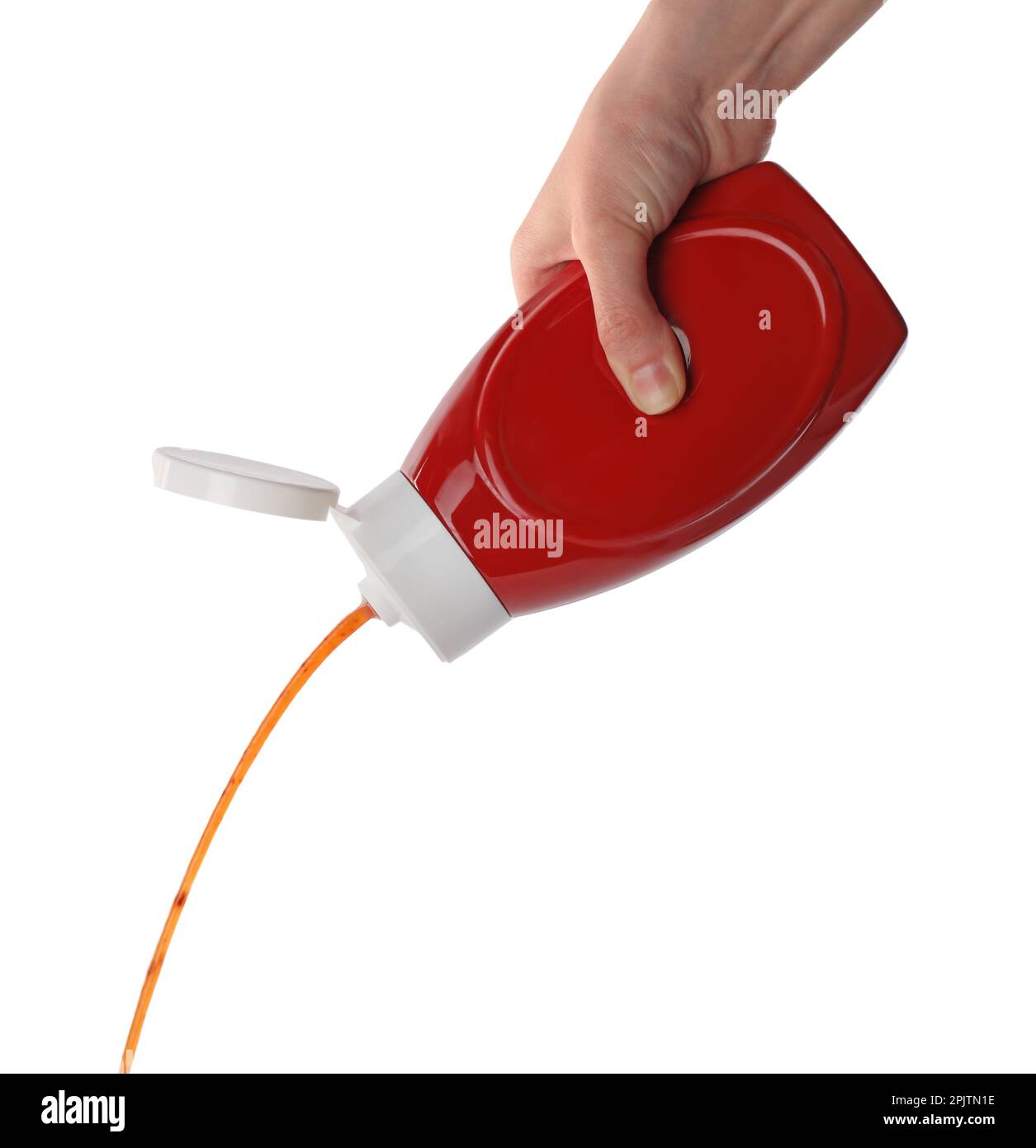 Ketchup pouring from bottle Cut Out Stock Images & Pictures - Alamy