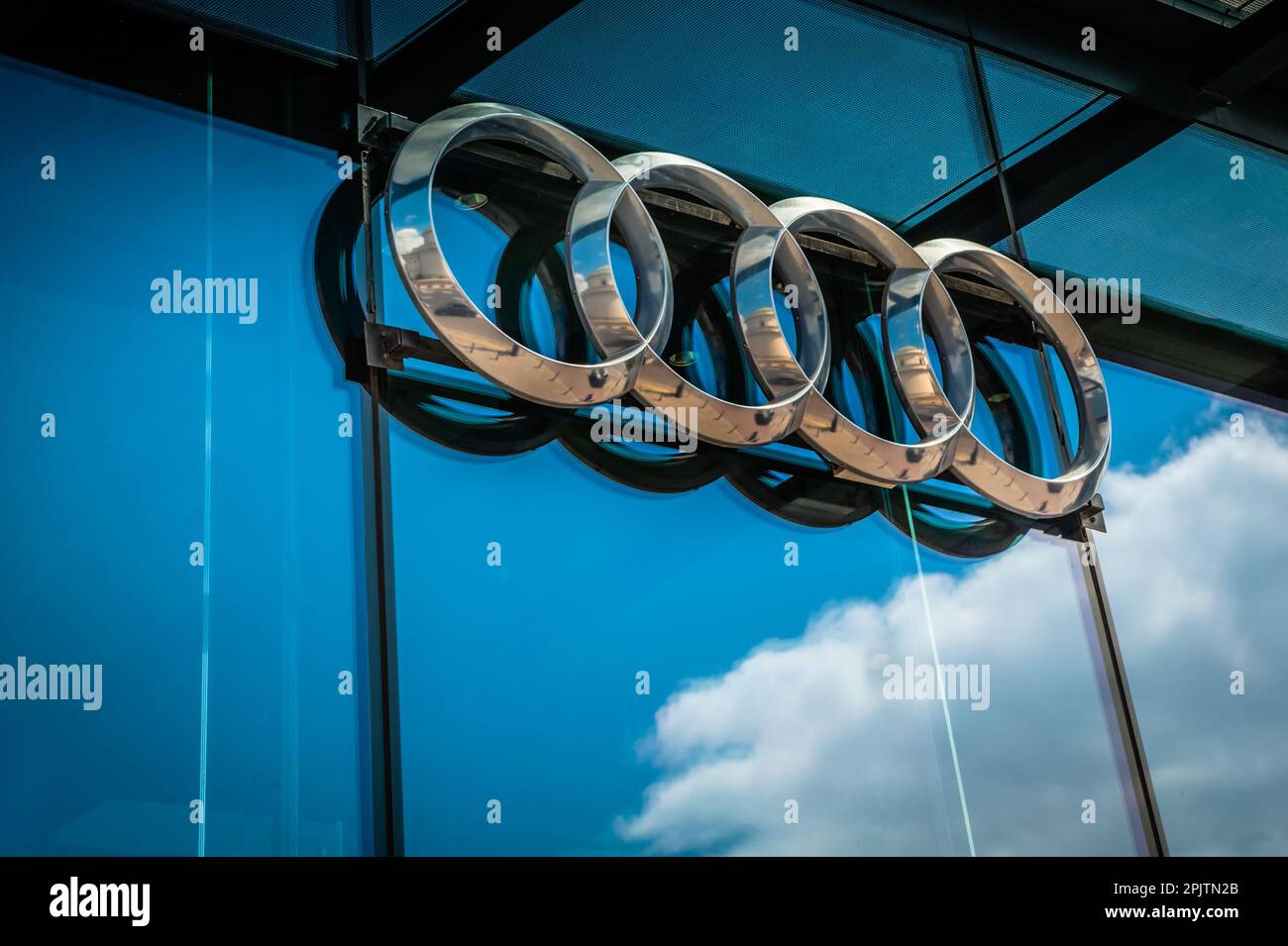 Warshaw, Poland - May 14, 2022: Glass facade of building with Audi logo ...
