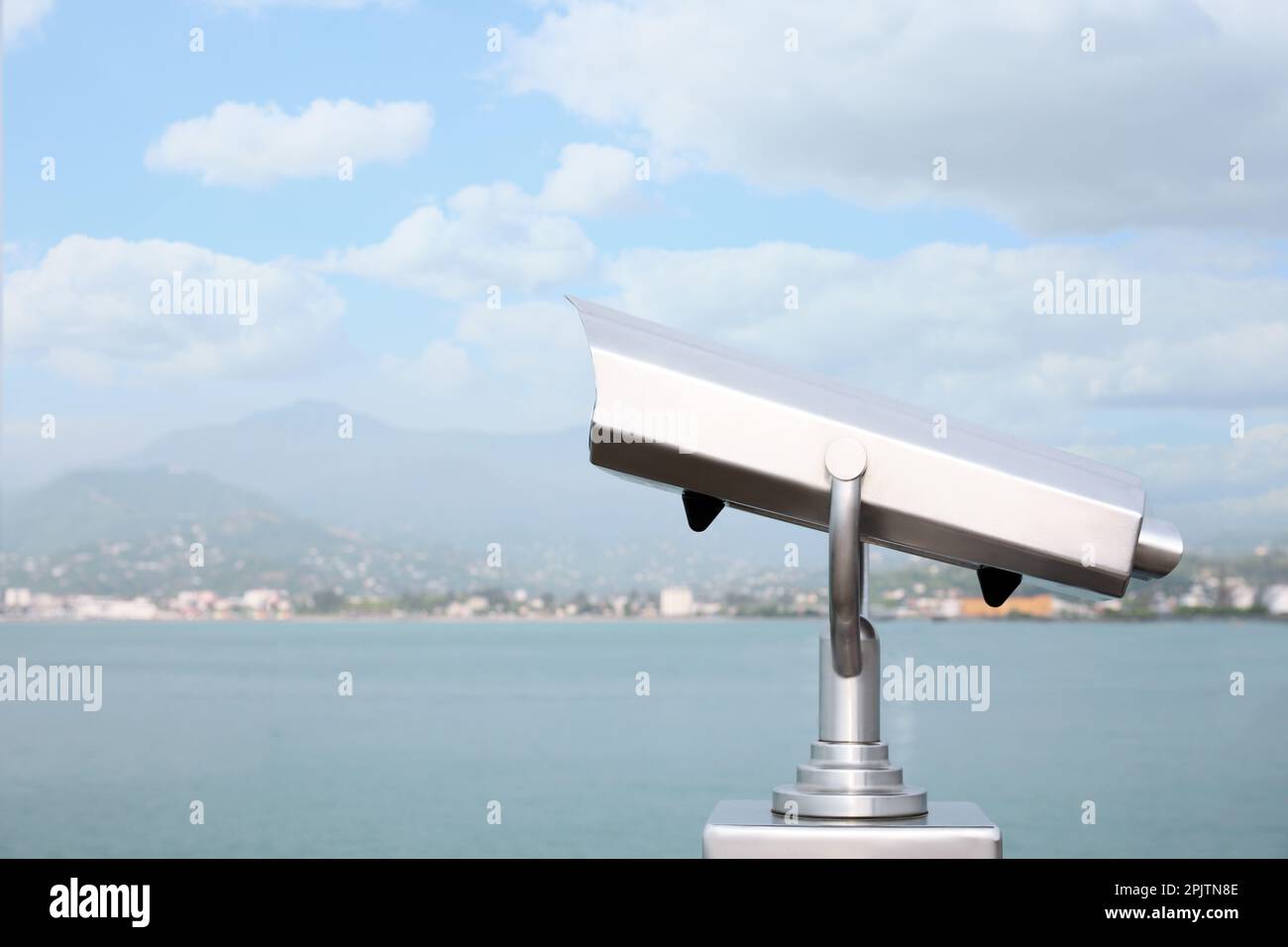 Metal tower viewer installed near sea, space for text. Mounted ...