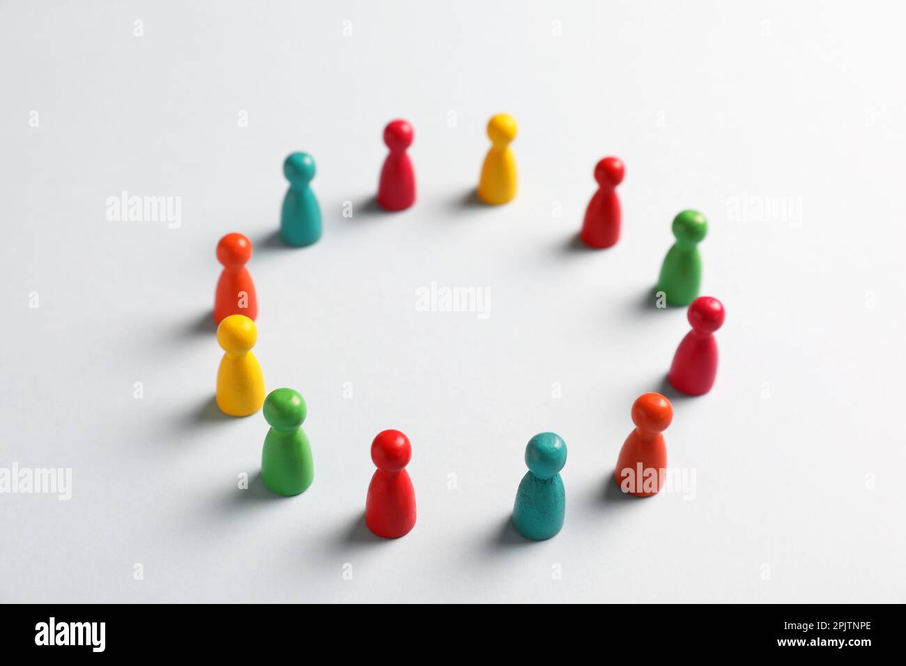 Colorful pawns on white background. Social inclusion concept Stock ...