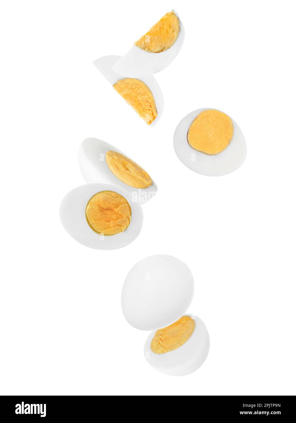 Tasty hard boiled eggs falling on white background Stock Photo - Alamy