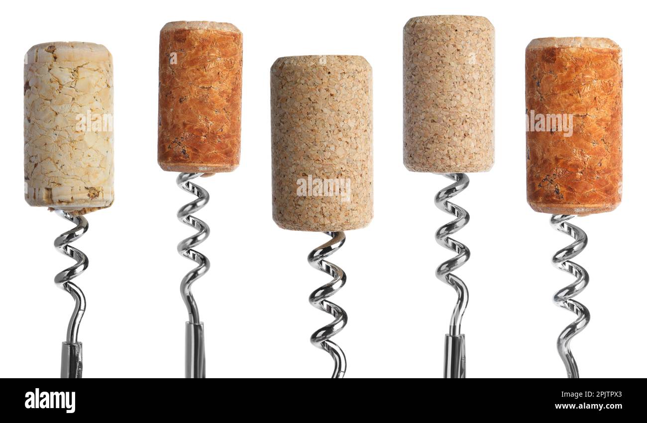 Corkscrews with wine corks on white background Stock Photo - Alamy