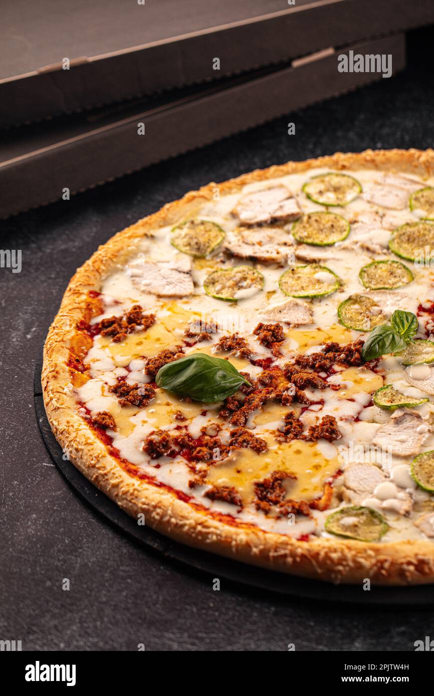 Big assorted pizza with variety of toppings Stock Photo - Alamy