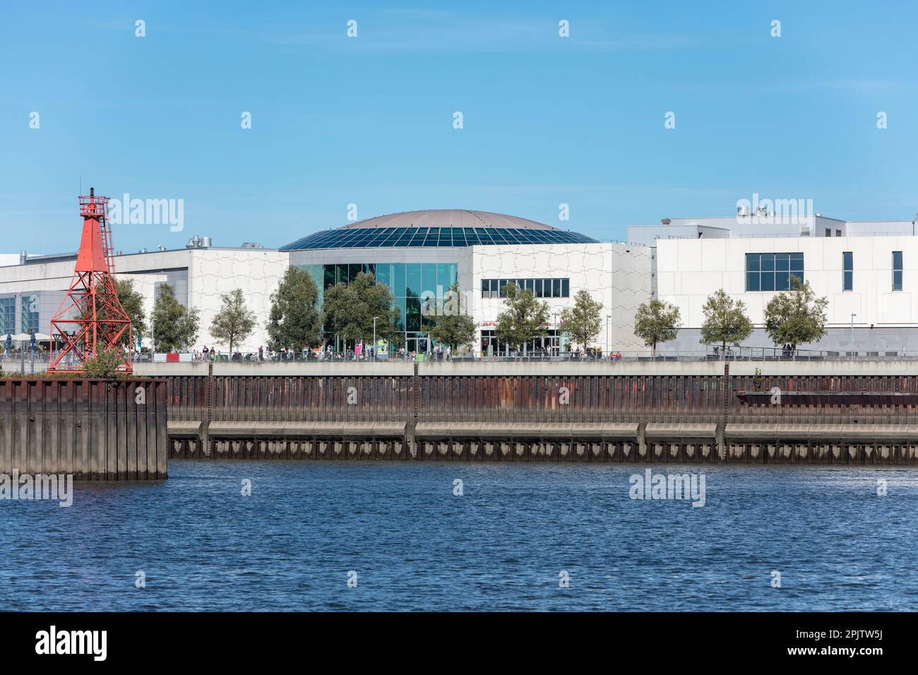 Waterfront shopping complex by the River Weser with promenade, shops ...
