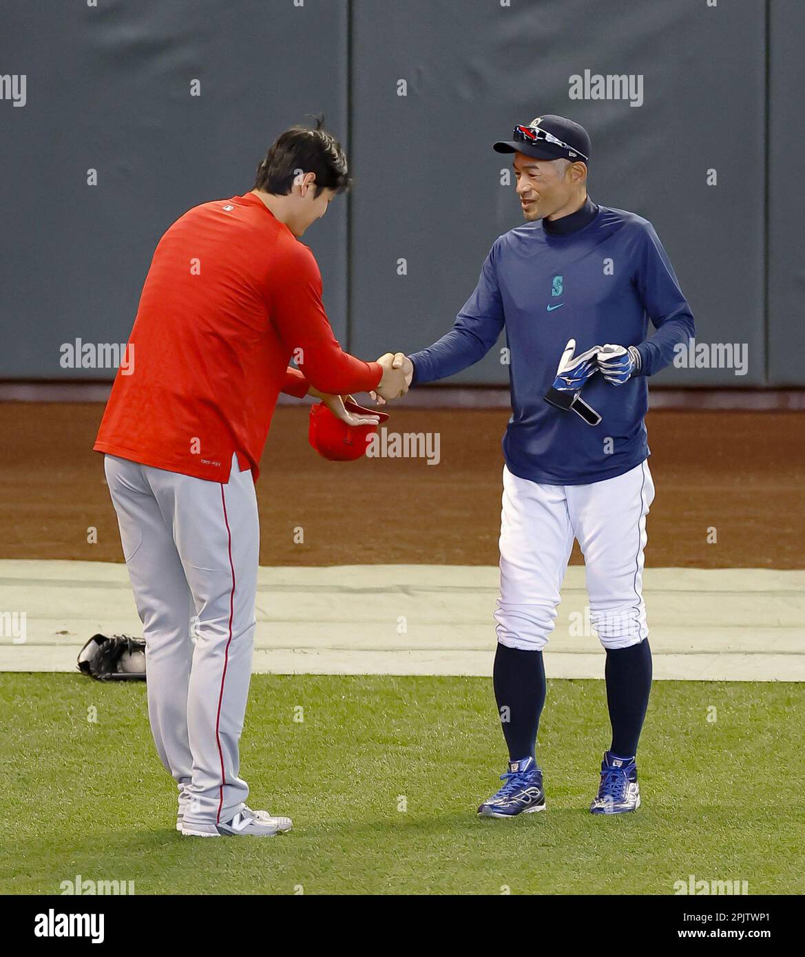 Los Angeles Angels two-way player Shohei Ohtani (L) shakes hands with ...