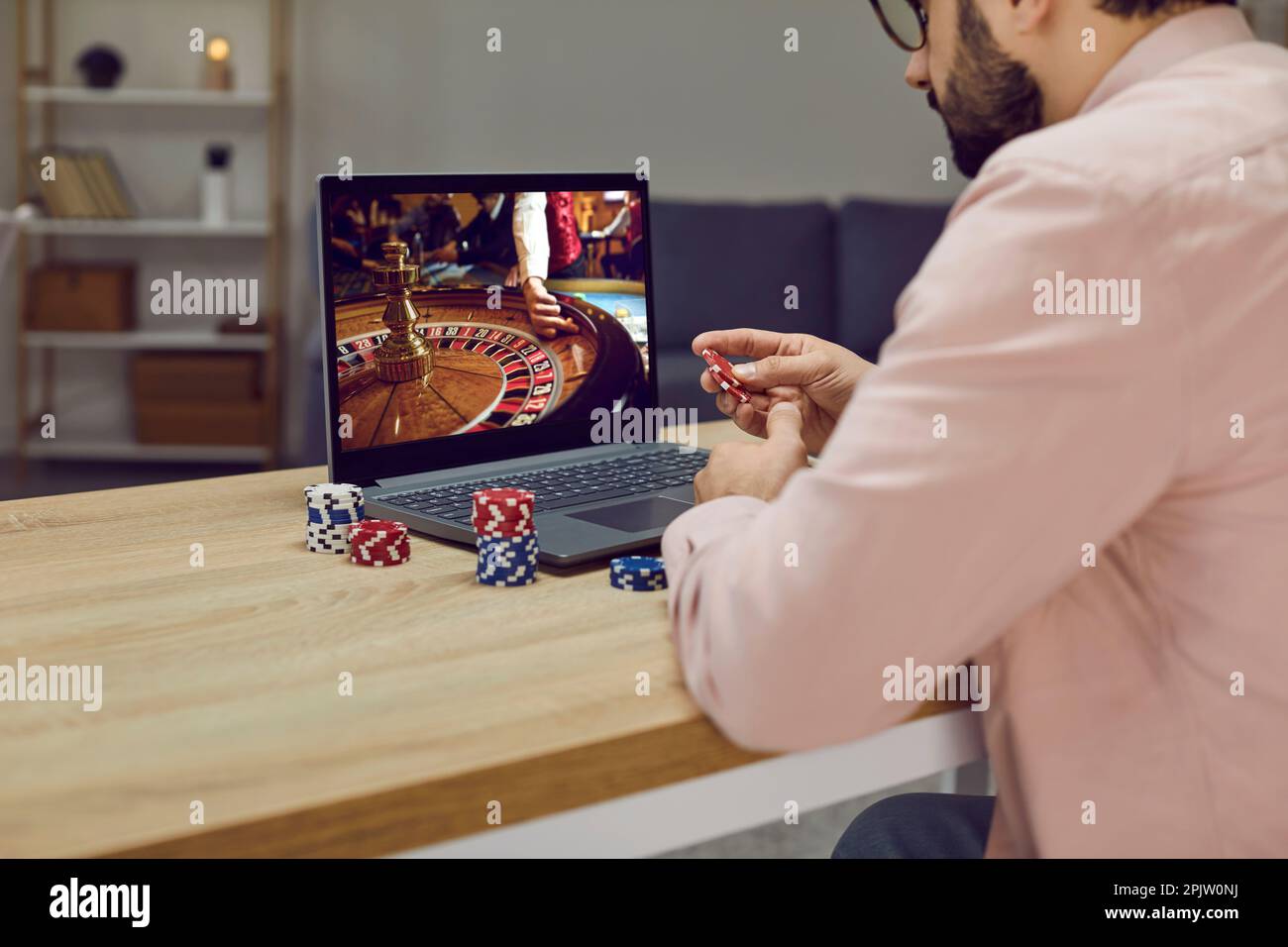 Man playing computer game sitting hi-res stock photography and images ...