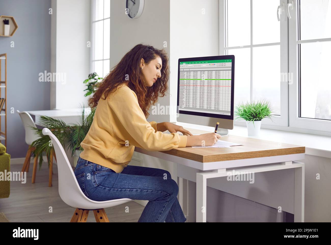 Female analyst working with spreadsheet data on computer screen Stock ...