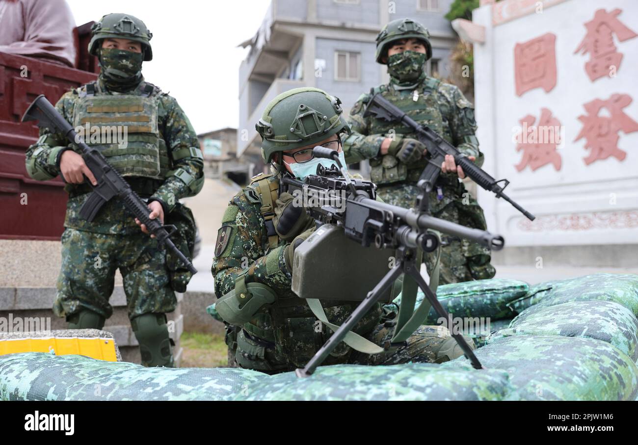 Republic of China Armed Forces (ROC Armed Forces) personnel guard during a marathon race as a ...