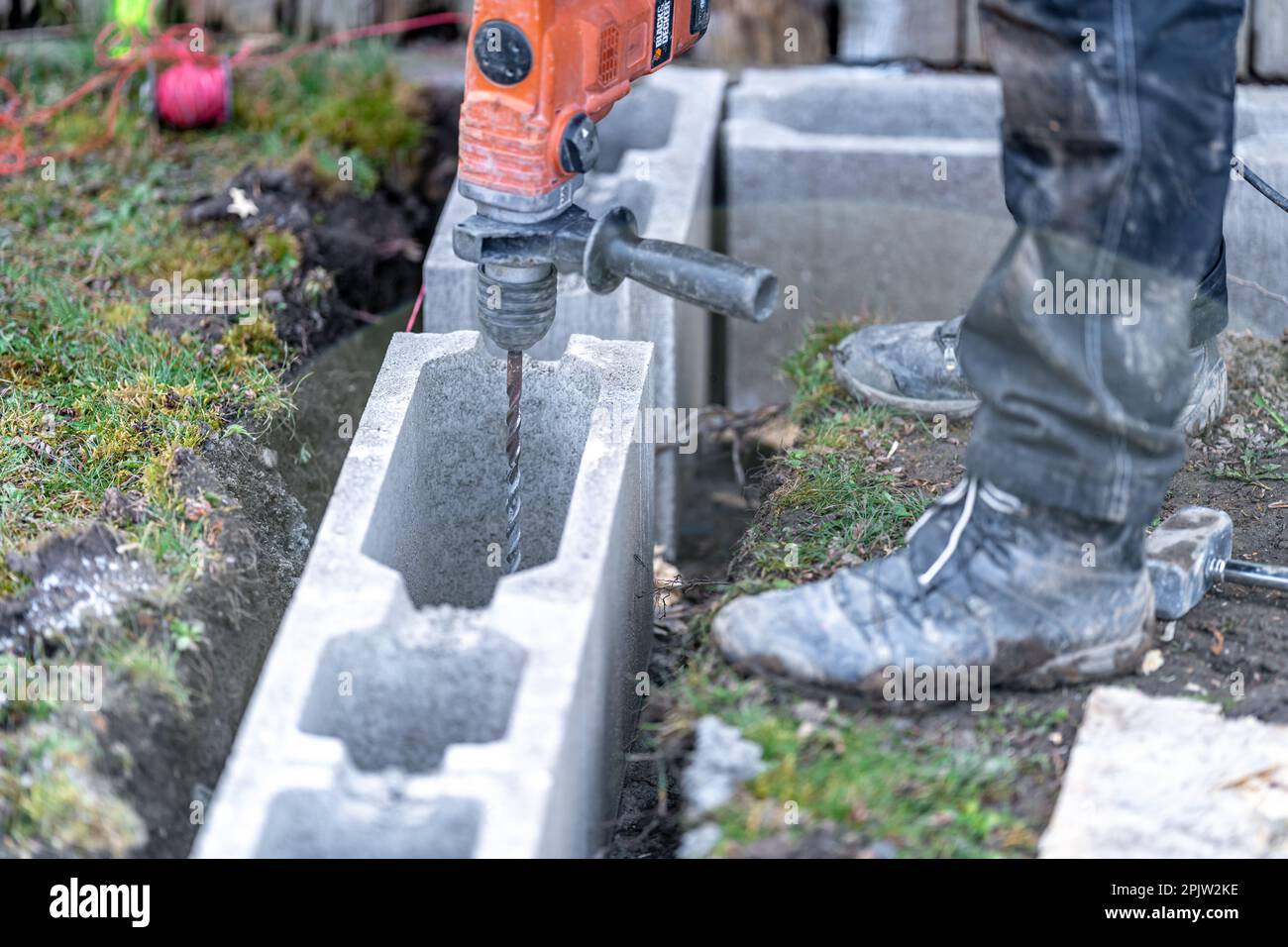 Drilling concrete foundations electric drill hi-res stock photography ...