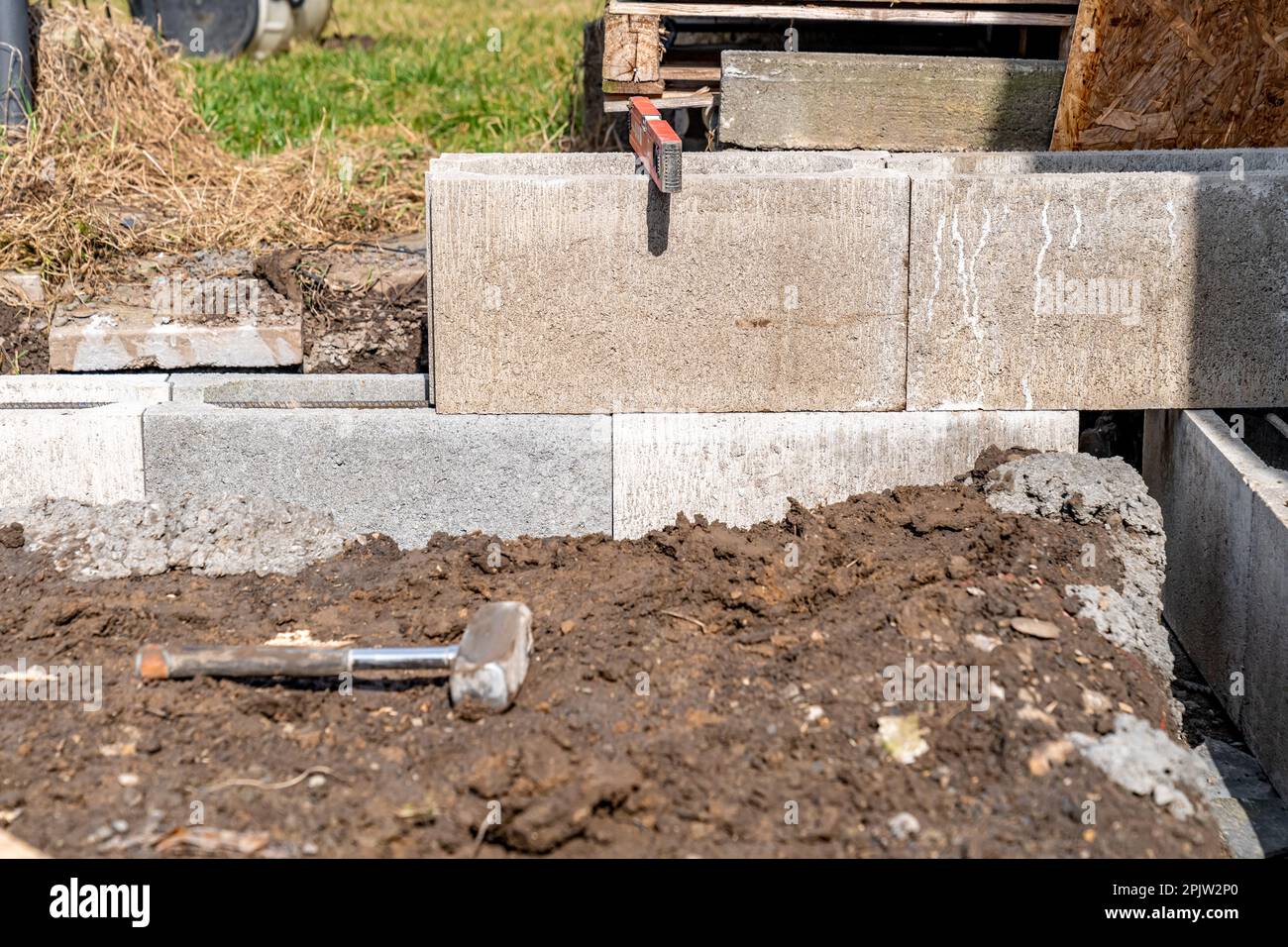 the foundation of the house is made of concrete blocks bound with metal ...