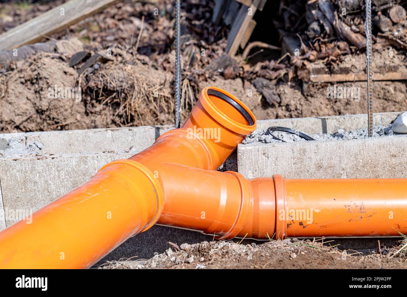PVC plastic pipe for sewerage in the ground Stock Photo - Alamy