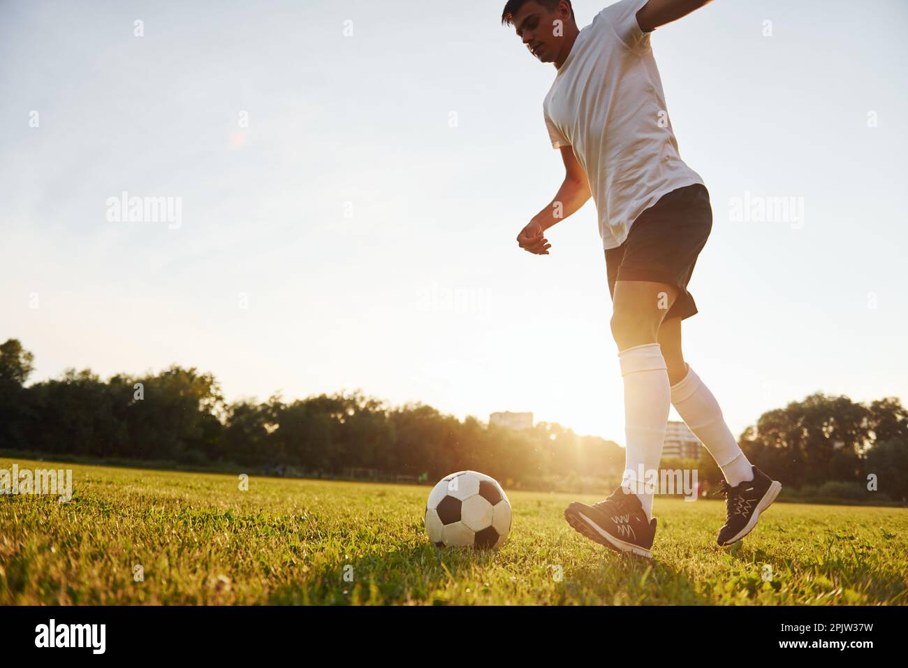 On the sportive field. Young soccer player have training Stock Photo ...