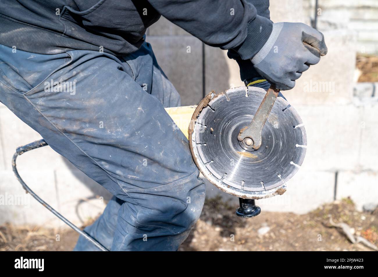 replacement of the grinding wheel on an electric grinder Stock Photo ...