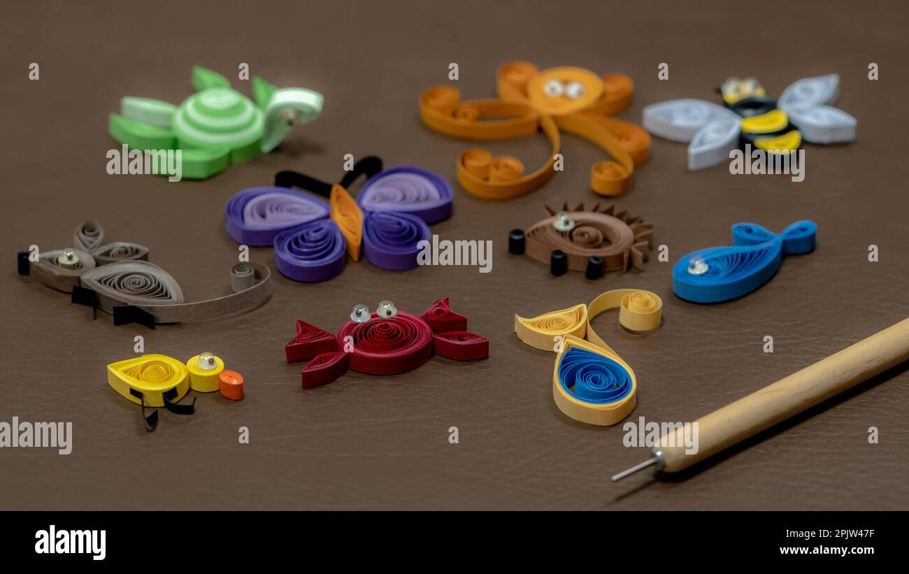 Paper quilled animals with craft tools and accessories for handicrafts ...