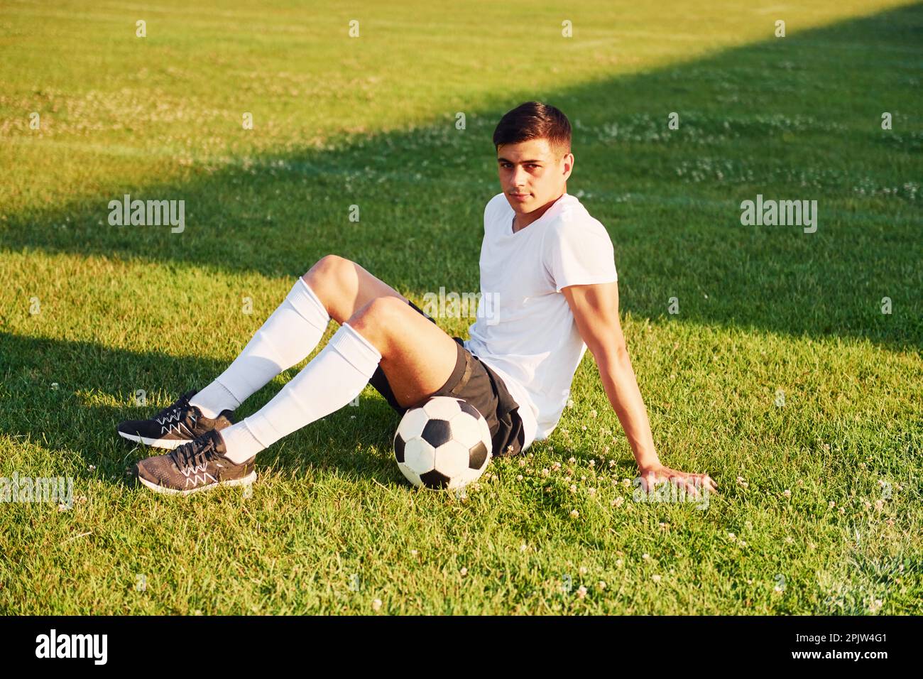 Young soccer player sitting in hi-res stock photography and images - Alamy
