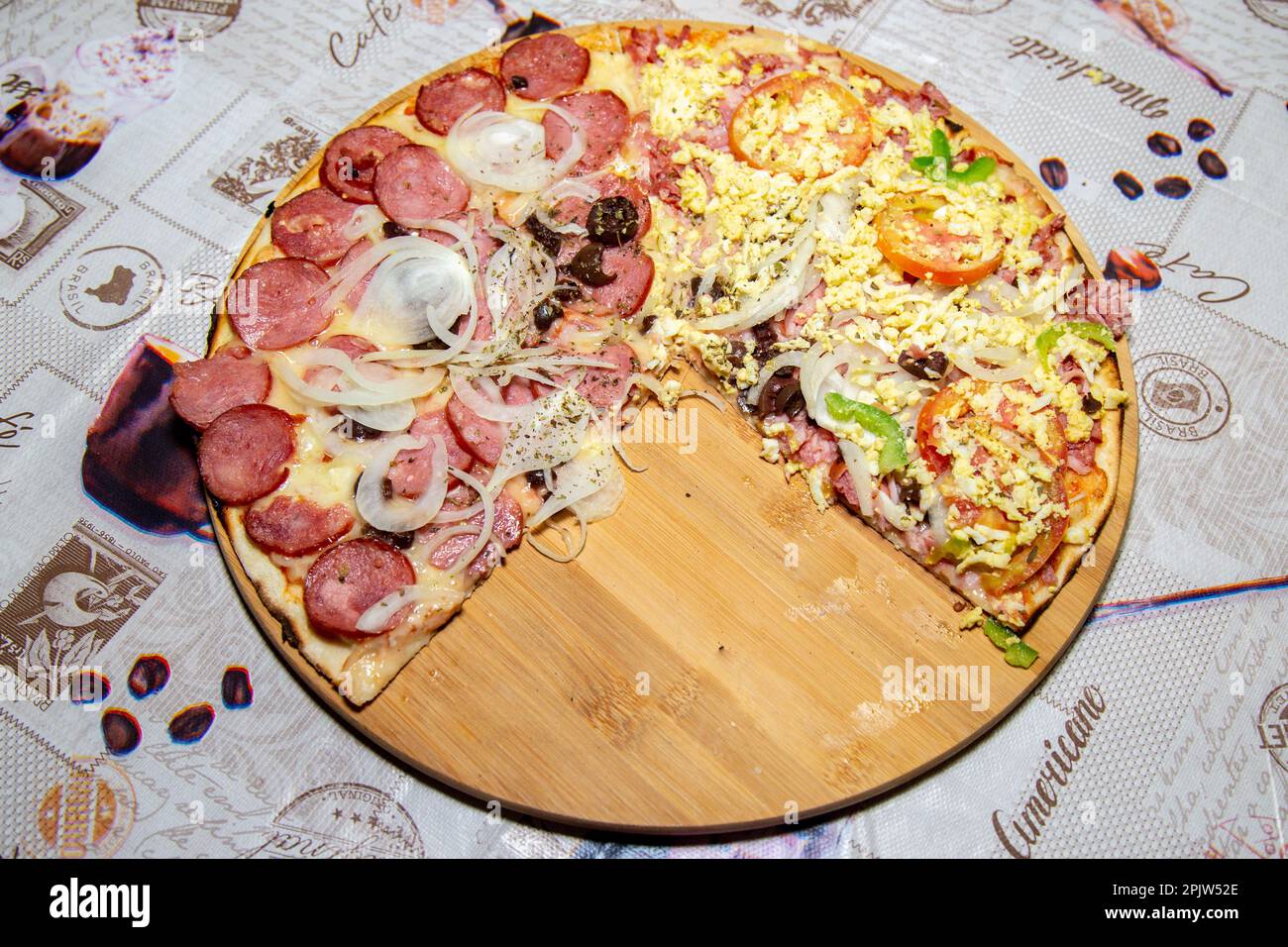 Traditional Brazilian pizza half Portuguese and half Calabrian Stock ...