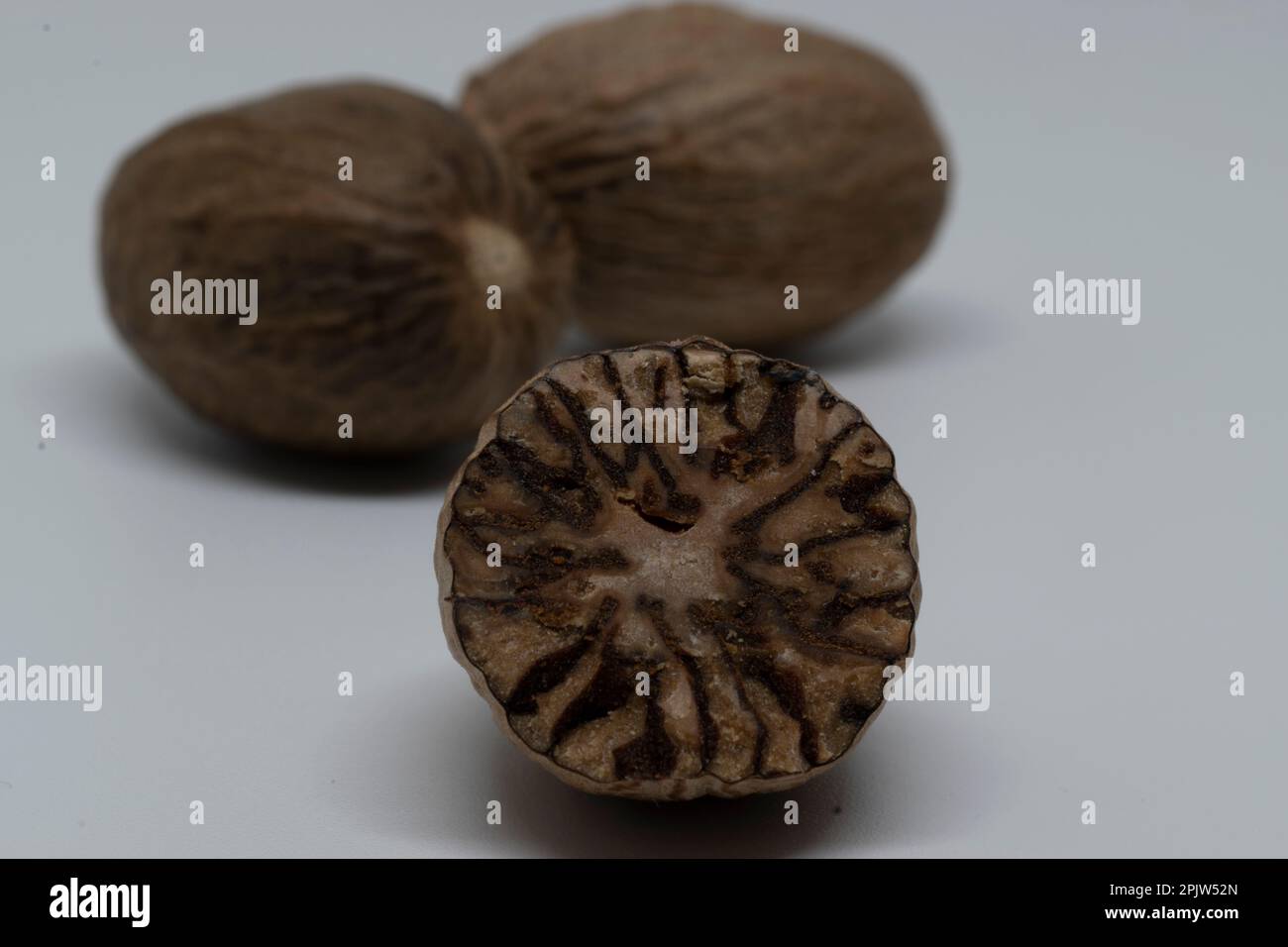 Nutmeg - white background Stock Photo - Alamy