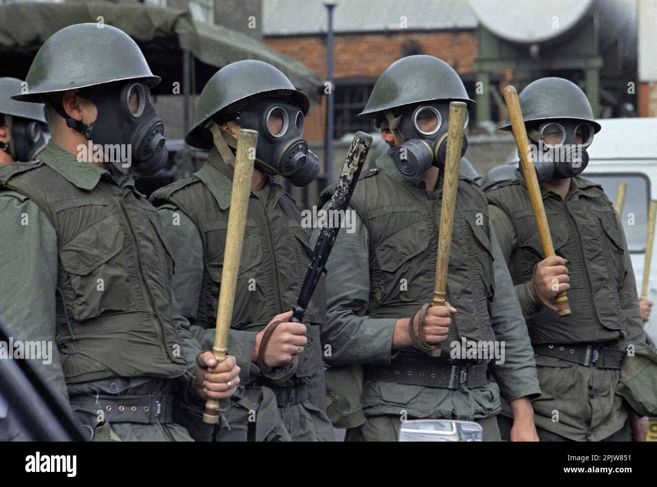 FILE - British Army Riot Squad troops wearing gas masks, bullet proof ...