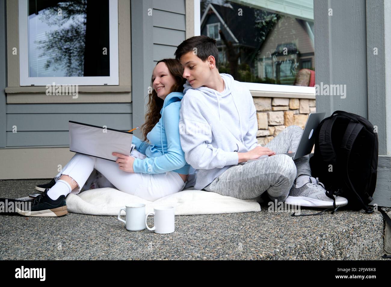 cheating exam boys teenage girls sitting on the porch with their backs ...