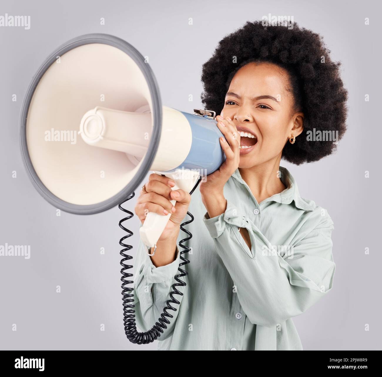 Megaphone, protest and black woman shouting in studio isolated on white ...