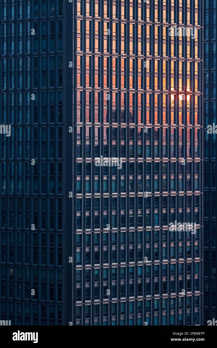 A front facade of a large office building at sunset Stock Photo - Alamy