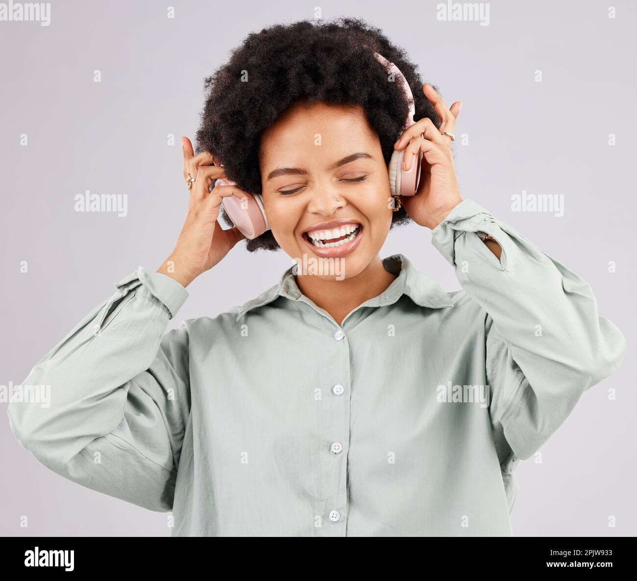 Music headphones, black woman and singing in studio isolated on a white ...