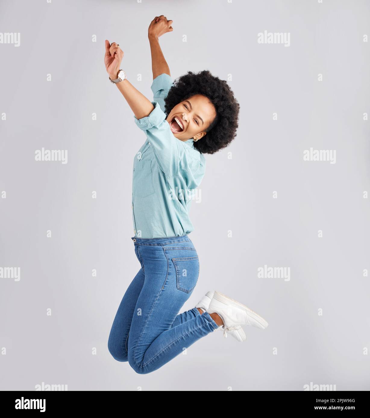 Excited, jump and black woman with success in studio with winning ...