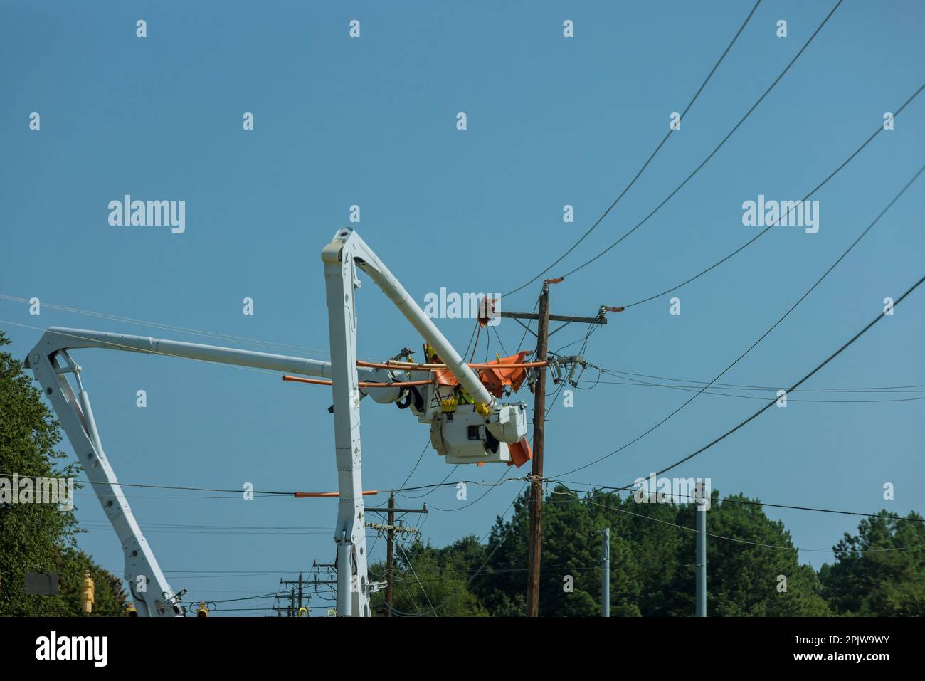As a result of storm, electrical workers in the power pole maintenance ...
