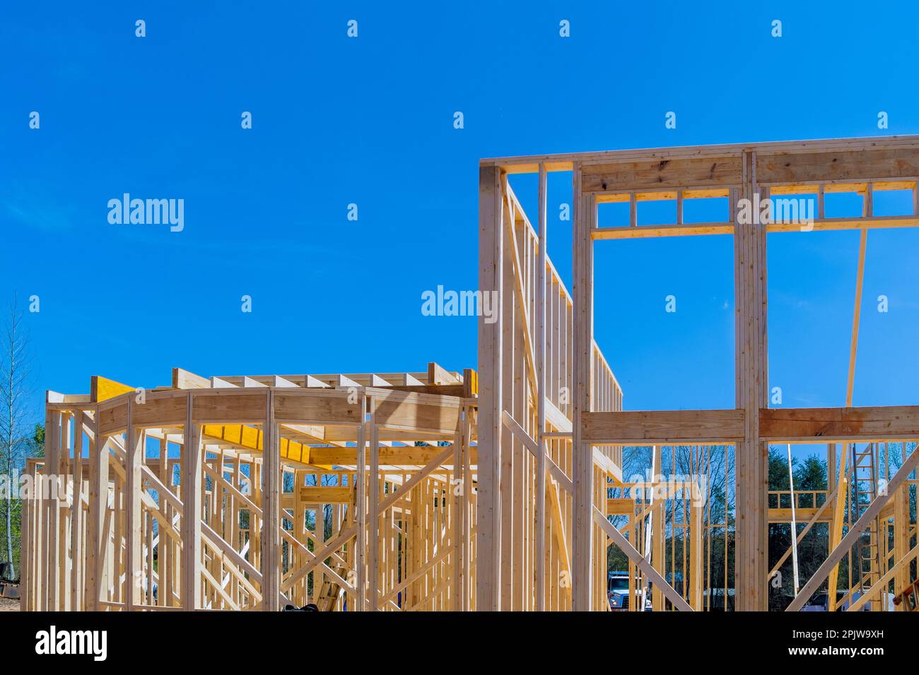 On construction site there are beams of wood stick framing which will ...